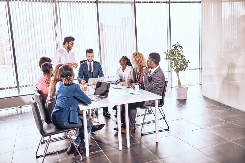 Happy Office Workers Gathered in the Conference Room Stock Photo ...