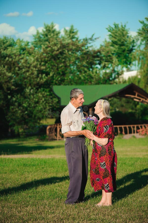 Happy Old Couple in a Park on a Sunny Day. Stock Photo - Image of ...