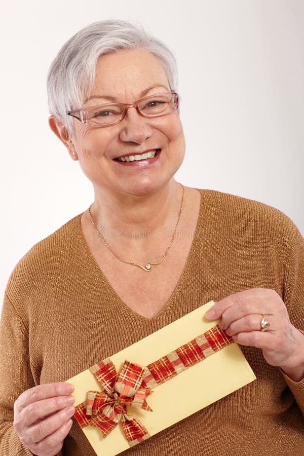 Happy Old Lady Holding Fancy Present Stock Photos - Free & Royalty-Free ...
