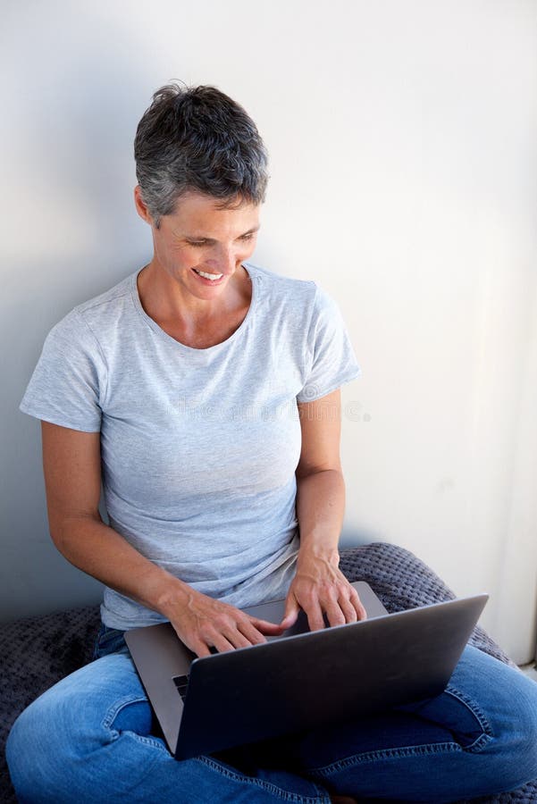 Happy Older Woman Using Laptop Computer Stock Image - Image of ...