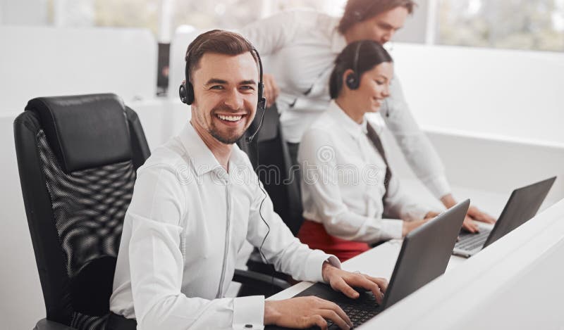 Happy Operator Using Laptop Near Team Stock Image - Image of indoors ...