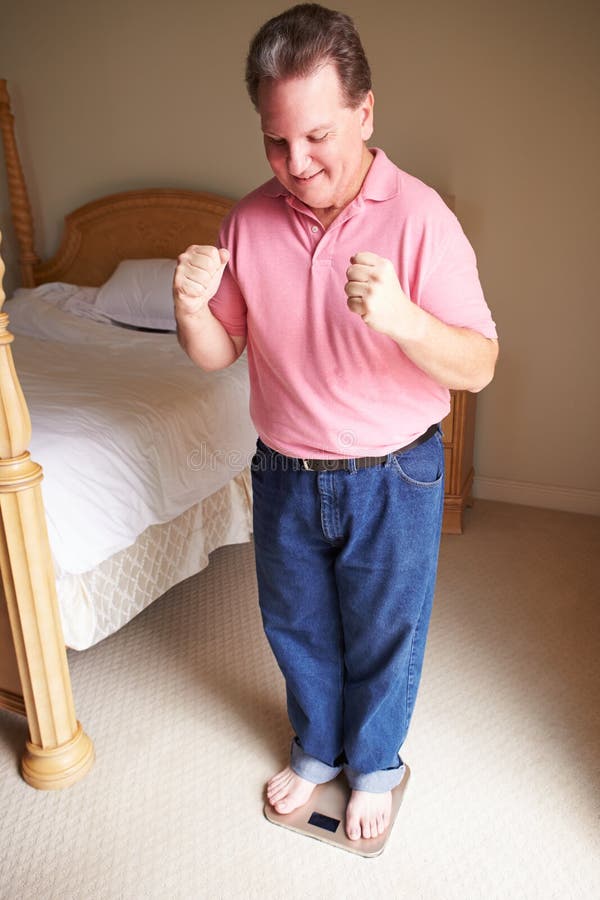Happy Overweight Man Standing on Scales in Bedroom Stock Image - Image ...