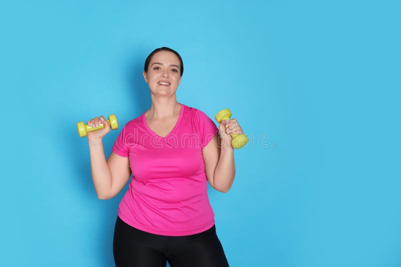 Happy Overweight Woman With Pizza And Cola On Sofa At Home Stock Image