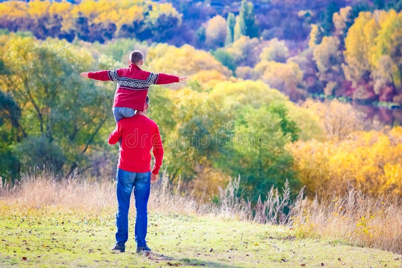 A Happy Parent with Child in Nature in the Park Weekend Stock Photo ...