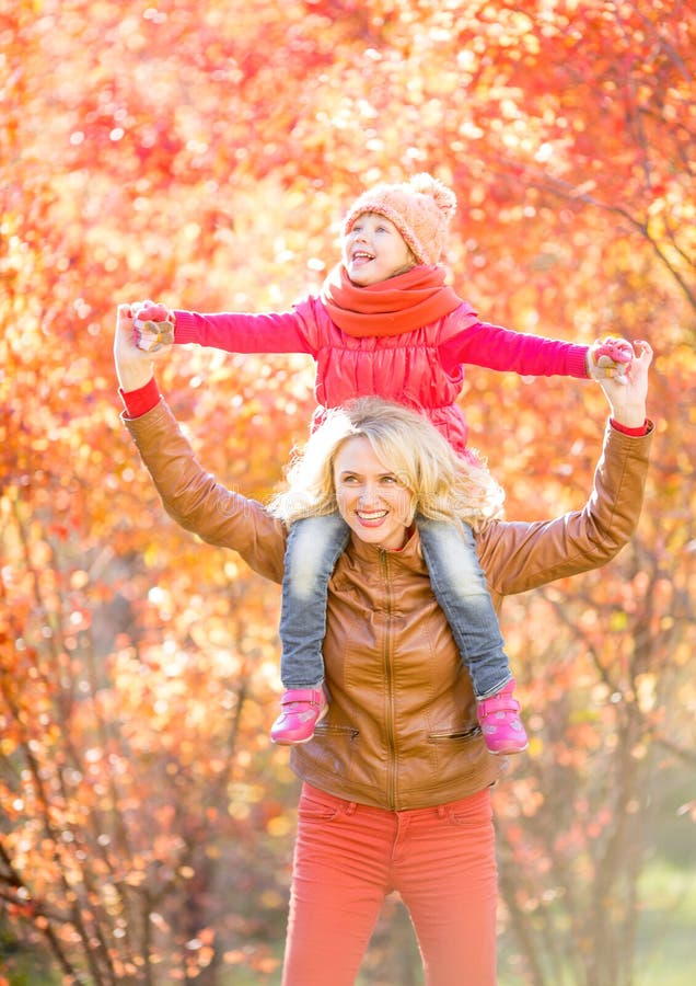 Happy Parent and Kid Family Walking Together Outdoor in Fall Stock ...