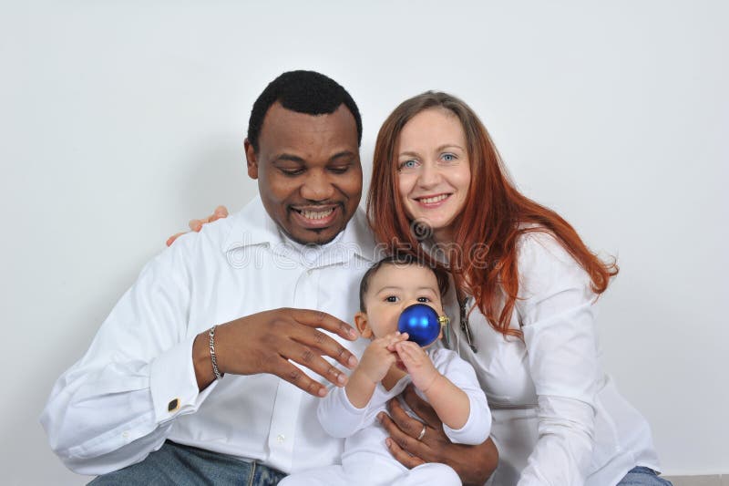 Happy parents and baby boy stock image. Image of happy - 25176515