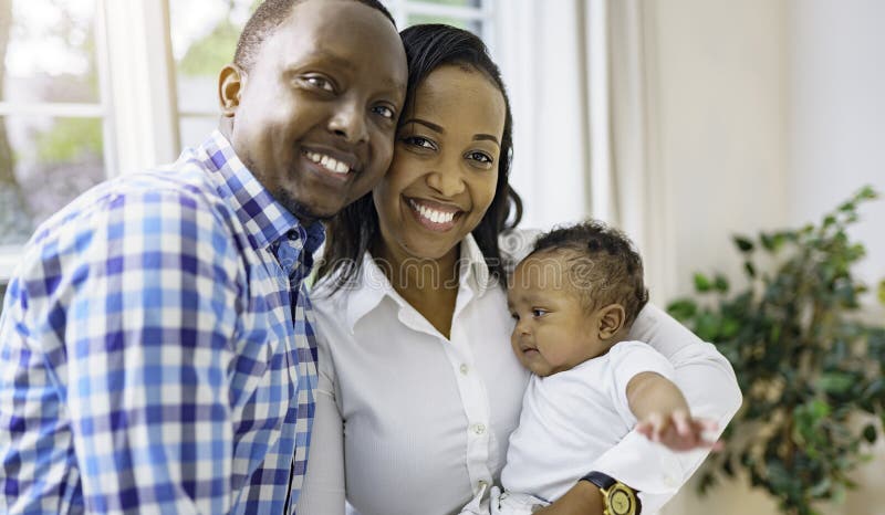 Happy Parents with Baby Boy at Home in the Bedroom Stock Photo - Image ...