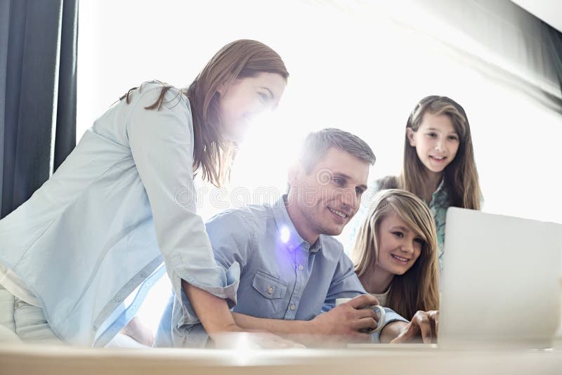 Happy Parents with Daughters Using Laptop at Home Stock Image - Image ...