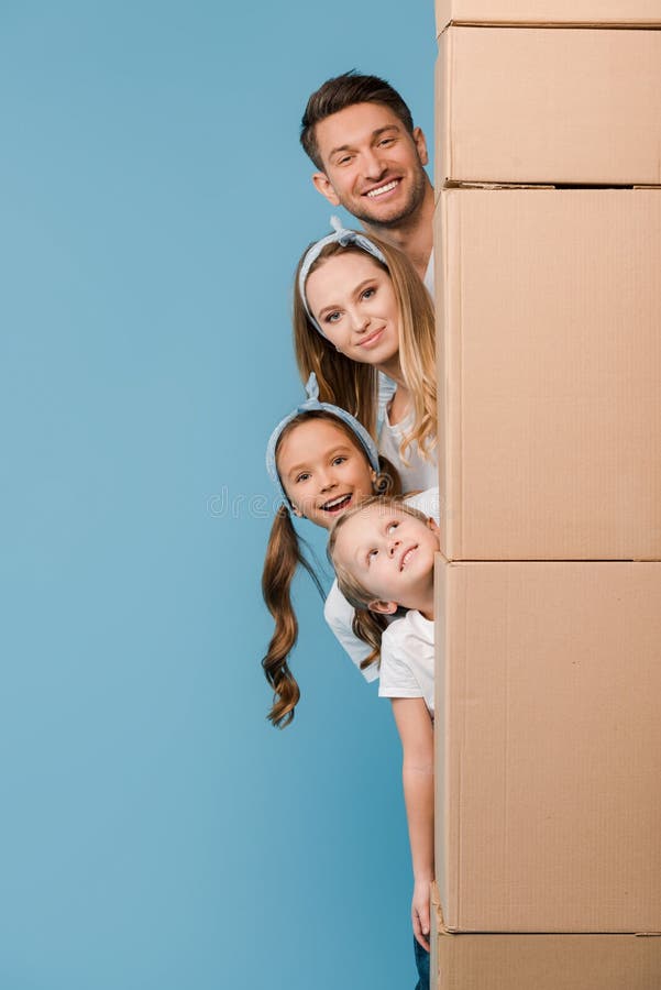 Parents and Kids with Cardboard Boxes for Relocation on Blue Stock ...