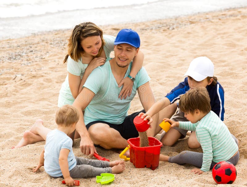 Parents and Kids Playing with Sand Stock Photo - Image of european ...