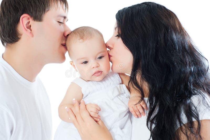 Parents Kissing Baby stock image. Image of love, kissing - 19258073