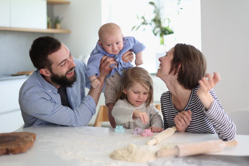 Young Parents Playing with Children in the Kitchen Stock Image - Image ...