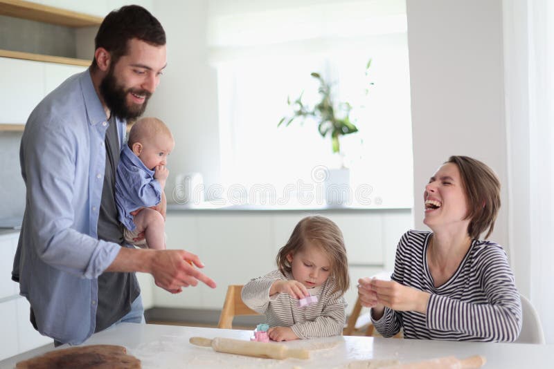 Young Parents Playing with Children in the Kitchen Stock Image - Image ...