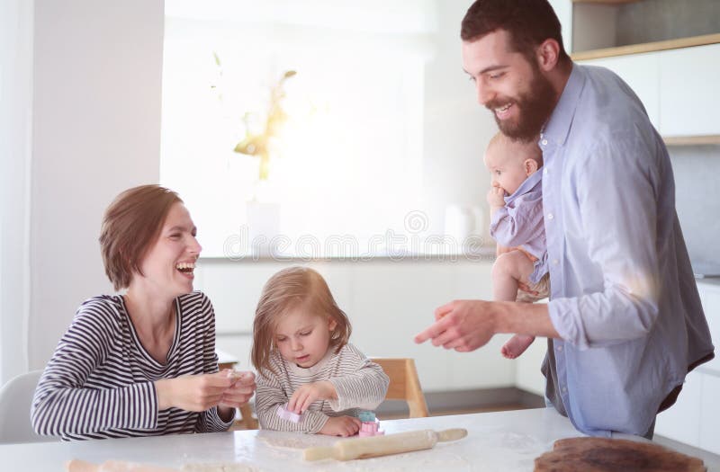 Young Parents Playing with Children in the Kitchen Stock Photo - Image ...