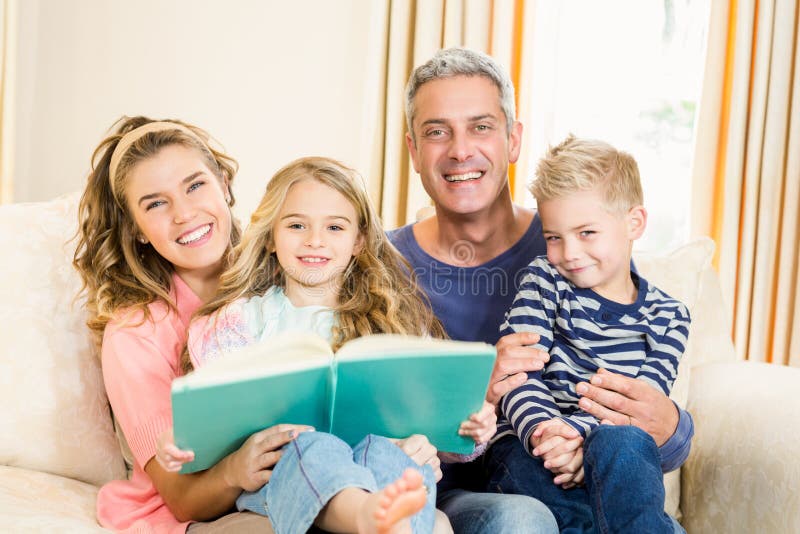Happy Parents Reading To Their Kids Stock Photo - Image of read, abode ...