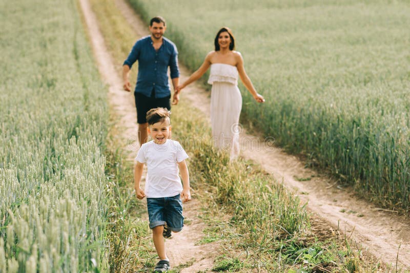 Happy Parents and Son Running on Path Stock Photo - Image of running ...