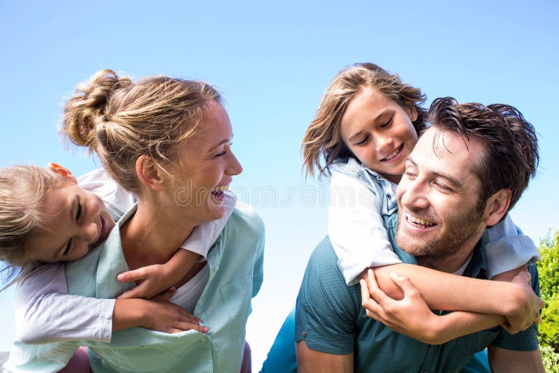 Happy Parents with Their Children Stock Image - Image of holding ...