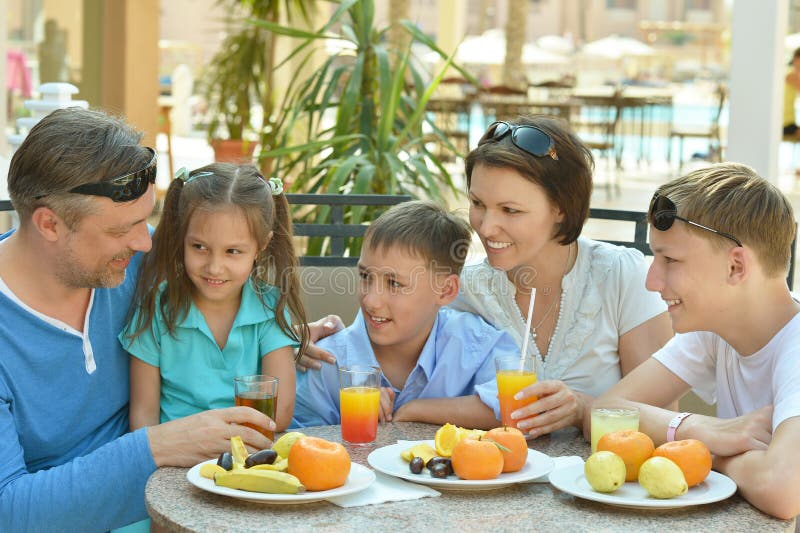 Happy Parents with Their Children Eating Stock Photo - Image of ...