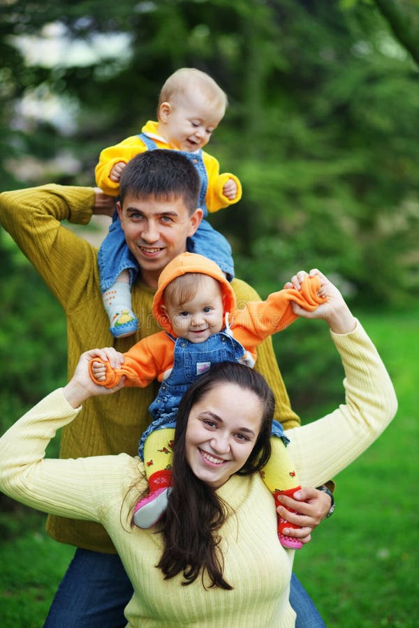 Happy parents with twins stock photo. Image of generation - 11601434
