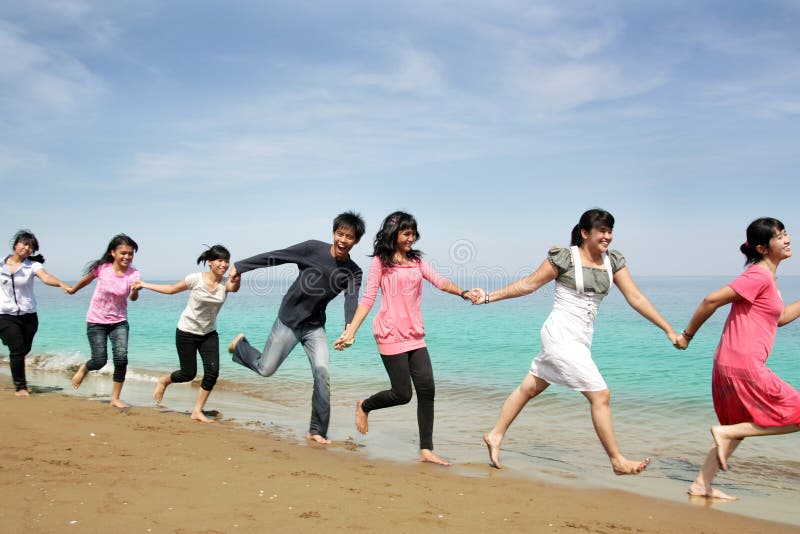 Happy people at beach stock photo. Image of walking, friend - 9479934