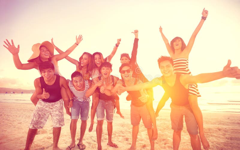 Happy Young People Jumping at the Beach on Beautiful Sunset Stock Image ...