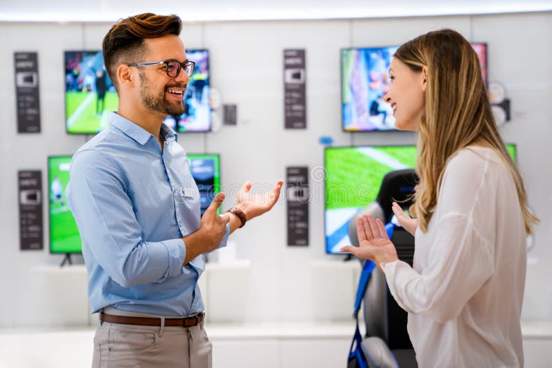 Happy People in Consumer Electronics Retail Store Looking at New ...