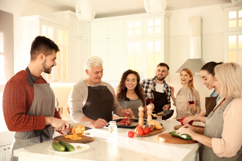 Happy People Cooking Food in Kitchen Stock Image - Image of kitchen ...