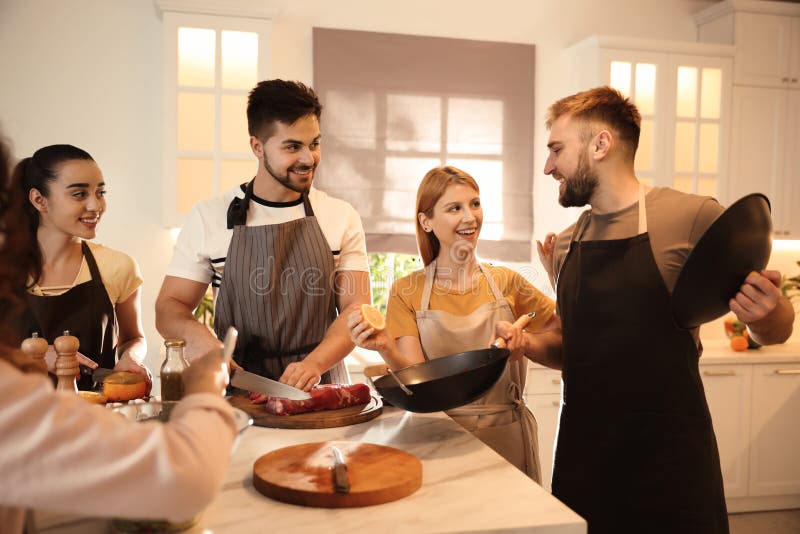 Happy People Cooking Food in Kitchen Stock Photo - Image of group ...