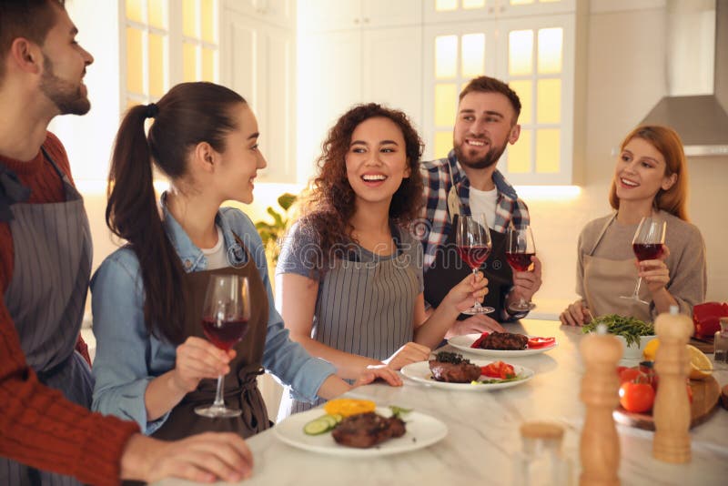 Happy People Cooking Food in Kitchen Stock Photo - Image of american ...