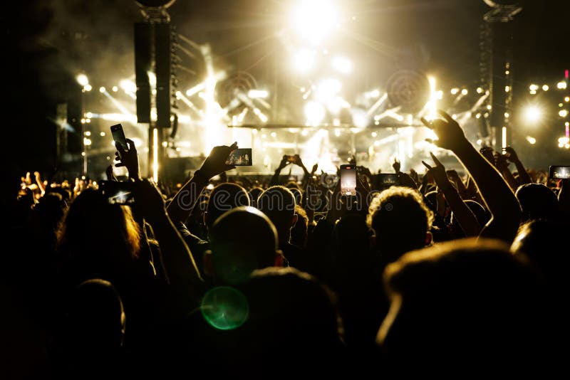 Happy People Crowd with Raised Hands on a Dance Floor during a Concert ...