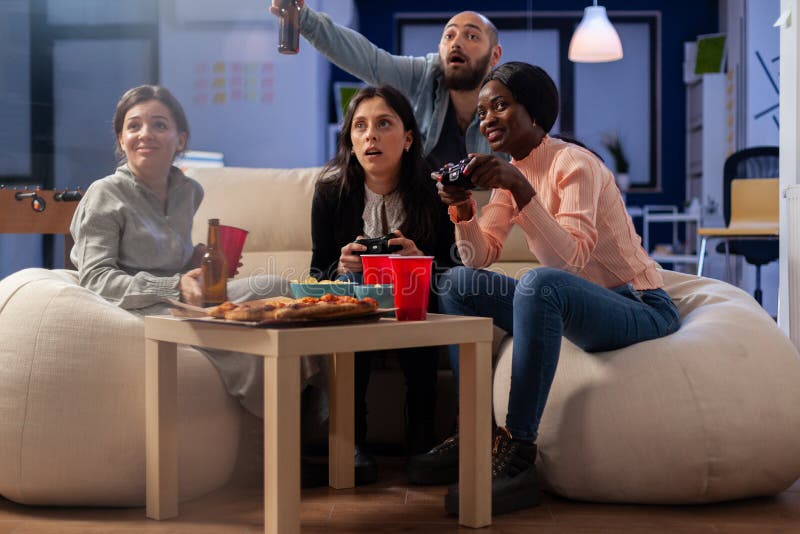 Happy People Enjoying Game on Console after Work at Office Stock Photo ...