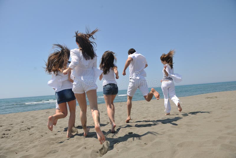 Happy People Group Have Fun and Running on Beach Stock Image - Image of ...
