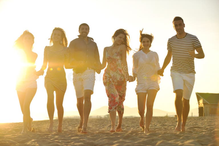 Happy People Group Have Fun and Running on Beach Stock Photo - Image of ...
