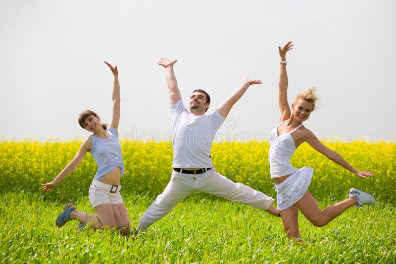 Happy People is Jumping in Field Stock Photo - Image of male, body: 9675518