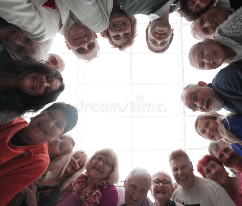 Happy People Looking Down at Camera Stock Image - Image of huddle ...