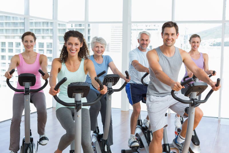 Happy People Working Out at Spinning Class Stock Image - Image of ...