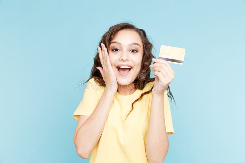 Happy Person with Credit Card Isolated in the Blue Studio. Stock Image ...