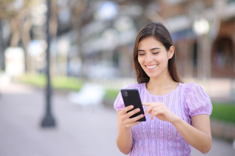 Happy Person Using Cell Phone in the Street Stock Image - Image of ...