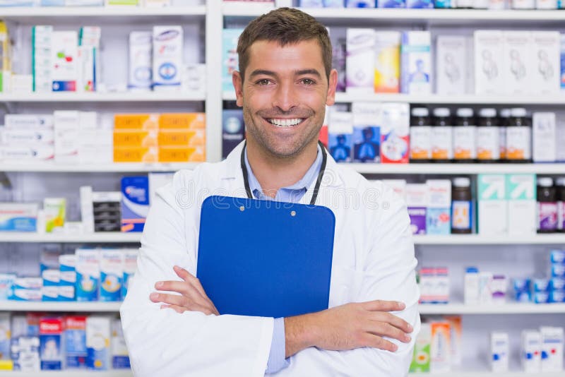 Happy Pharmacist Holding Clipboard Stock Photo - Image of storage ...