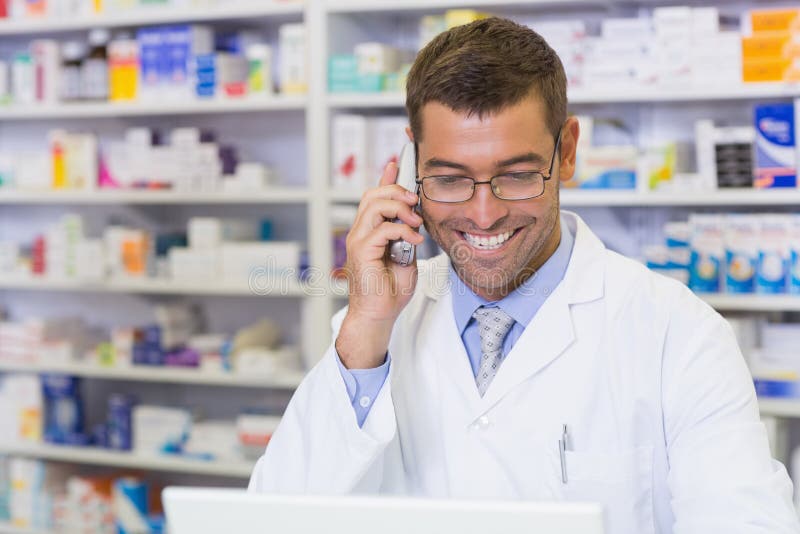 Happy Pharmacist Using The Computer Stock Image - Image of person ...
