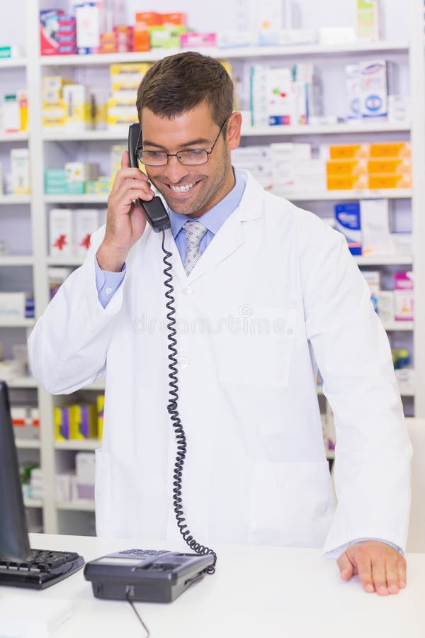 Happy Pharmacist on the Phone Stock Photo - Image of pharmacy ...