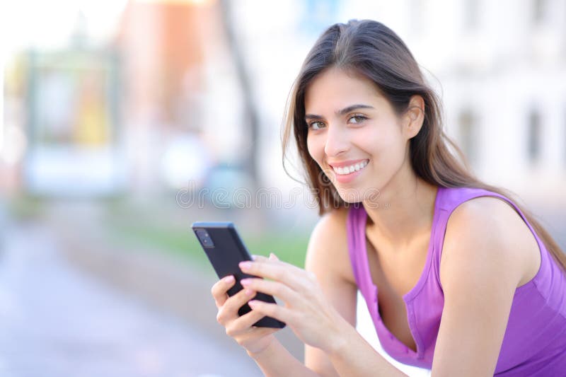 Happy Phone User Looks at Camera Stock Image - Image of smart, cell ...