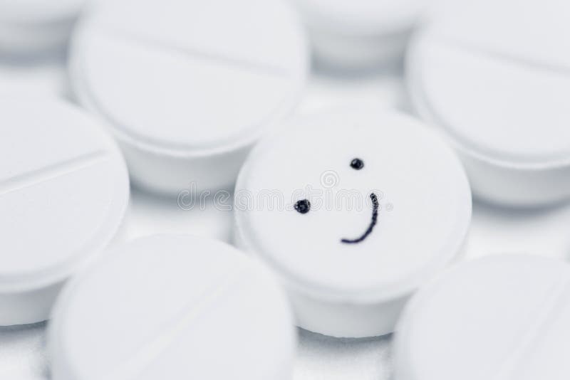 Happy Pill Surrounded by White Prescription Pills Stock Photo - Image ...