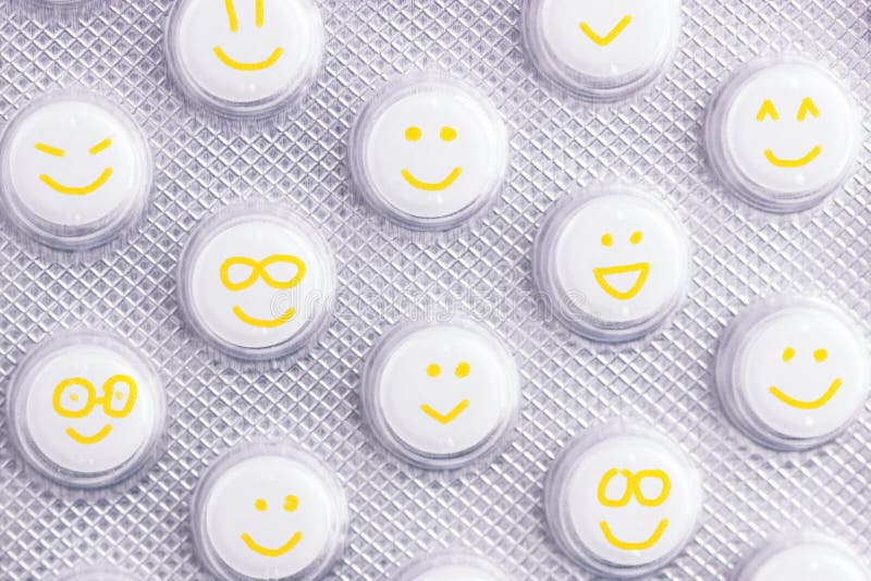 Happy Pills, Sad Mood Treatment for Everyone, Smiley Tablets on a Table ...