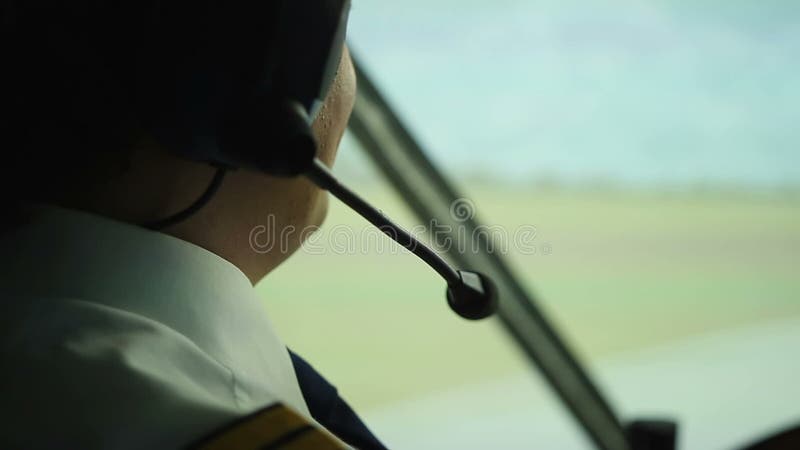 Happy Pilot Talking To Controller, Navigating Airliner while Moving on ...