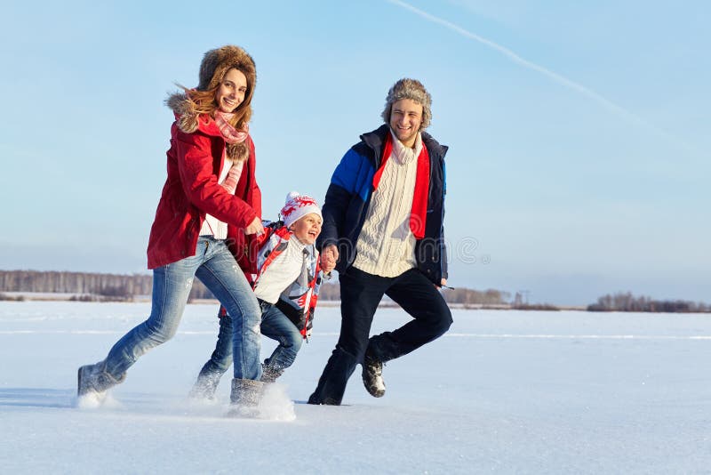 Happy Playing Family in the Winter. People Outdoors Stock Image - Image ...