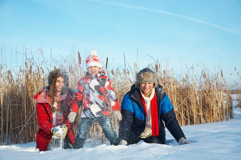 Happy Playing Family in the Winter. People Outdoors Stock Photo - Image ...