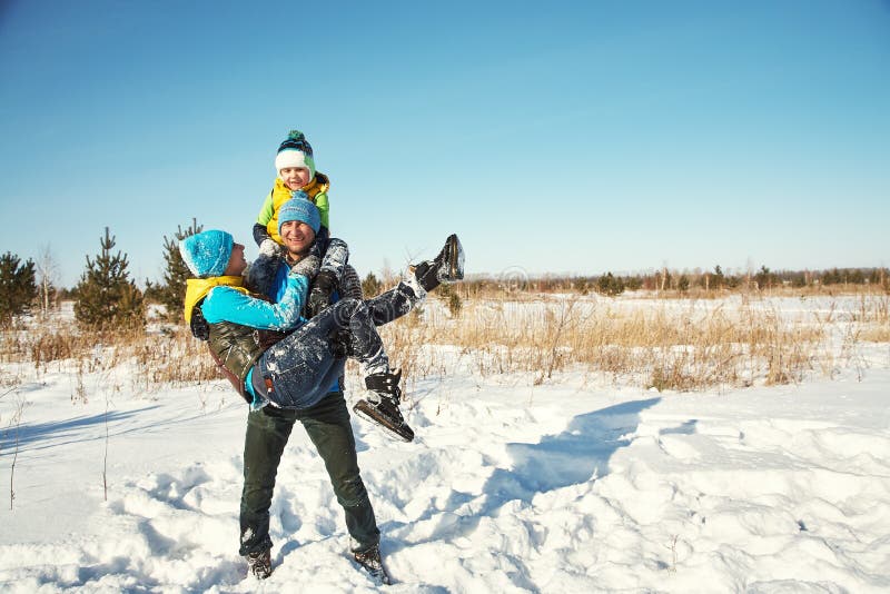 Happy Playing Family in the Winter. People Outdoors Stock Image - Image ...
