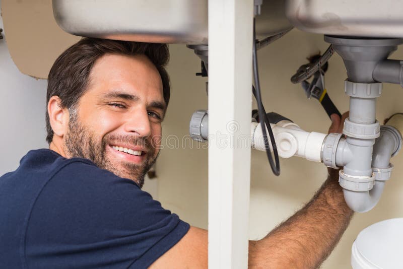 Happy Plumber Fixing Under the Sink Stock Image - Image of pipe, tool ...
