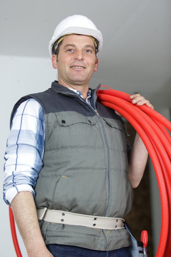 Happy plumber at work stock image. Image of bath, appartment - 254759813